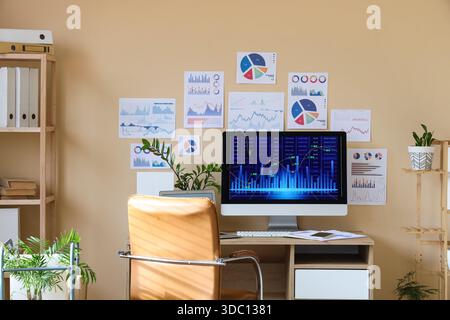 Interior of data scientist's office with workplace, diagrams and shelf ...