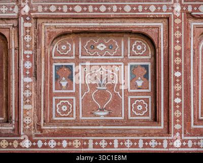 Detail of red sandstone panel with white marble inlay on exterior of ...
