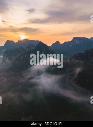 A breathtaking golden sunrise or sunset casts long shadows across a ...