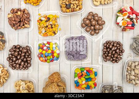 A chocolate bar filled with caramel and roasted peanuts displayed on a ...