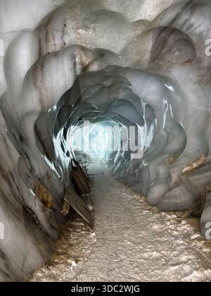Majestic blue ice formations inside cave glowing covered in frost ...