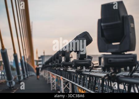 Professional projector lamps on metal rack in studio Stock Photo - Alamy