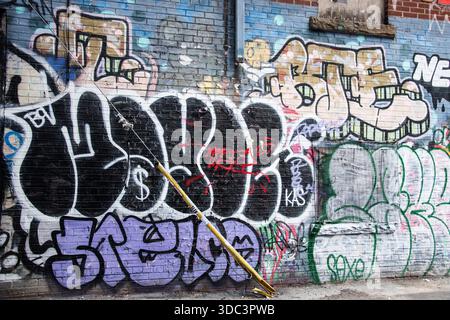 Graffiti tagged at Graffiti Alley fashion district in downtown Toronto ...