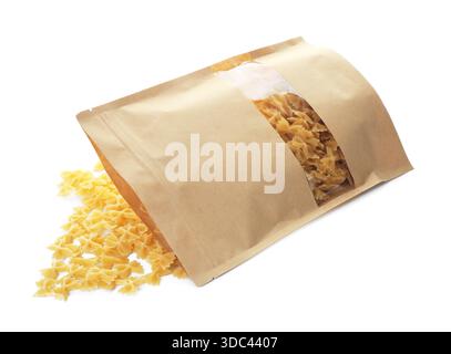 Stand-up pouch with raw pasta on wooden table against tiled background ...
