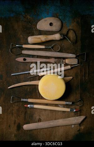 Tools for forming clay on wooden background Stock Photo - Alamy