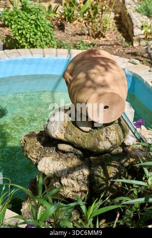 Traditional rustic handmade fountain in the mountain, where flows ...