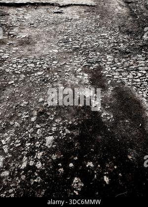Texture of a dirty bad dirt road dirt road with puddles and clay drying ...