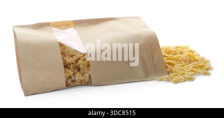 Stand-up pouch with raw pasta on wooden table against tiled background ...
