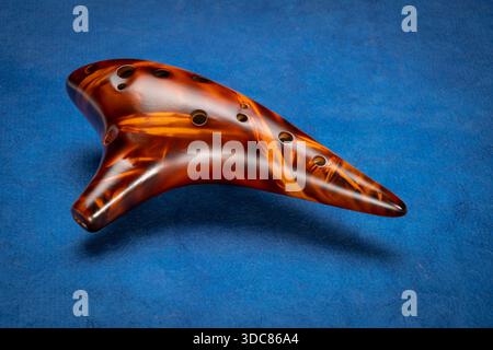traditional 12 hole ceramic ocarina, a small, wind musical instrument ...