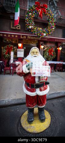 A life-size mannequin of Santa Claus for sale at the Christmas market ...