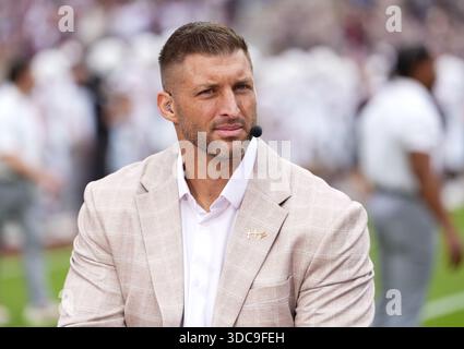 SEC Nation host Tim Tebow listens to his co-hosts during the SEC Nation ...