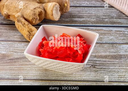 Red marinated sliced ginger roots heap Stock Photo - Alamy