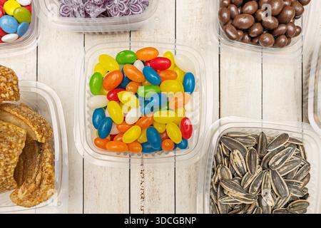 A chocolate bar filled with caramel and roasted peanuts displayed on a ...