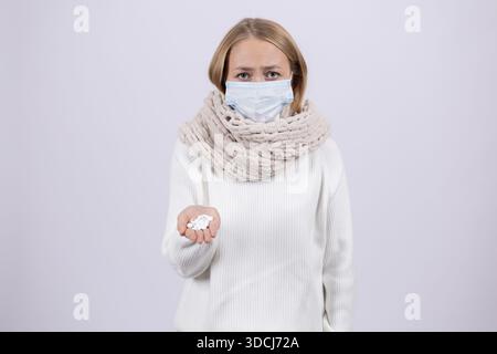 Hand holding thermometer and pills for fever and illness Stock Photo ...
