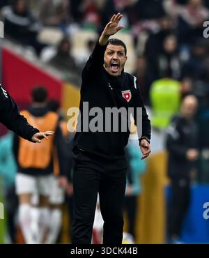 Jordan head coach Jamal Sellami speaks during a news conference ahead ...