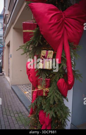 Festive outdoor display of colorful wrapped gift boxes alongside shiny ...