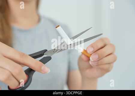 No smoking. Woman stop smoke, refuse, reject, destroy, smash cigarette ...