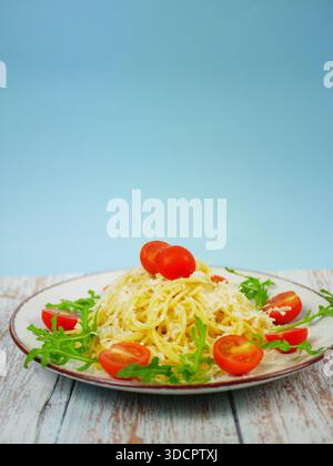 Italian spaghetti on blue background copy space food and drink concept ...