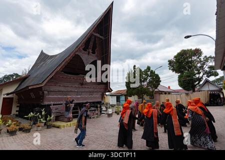 Indonesian women wearing muslim clothes dancing traditional Batak dance ...