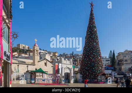 Nazareth, Israel, December 24, 2025, Giant christmas tree and the greek ...