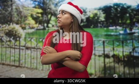 Plus size hispanic woman wearing sportswear and headphones surprised ...