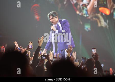 TAIPEI, CHINA - DECEMBER 26, 2025 - Taiwanese singer Sam Lee holds a ...