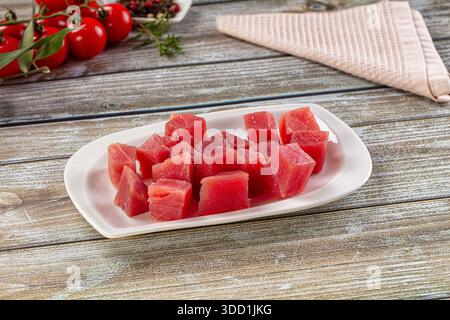 Raw tuna fish cubes heap for poke Stock Photo - Alamy