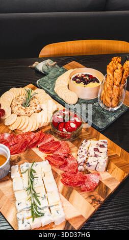 A top view of a cheese platter with a sauce for appetizers served on a ...