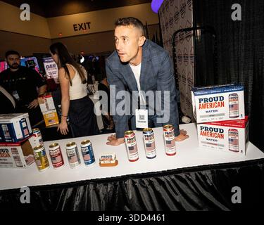 An exhibitor at AmericaFest 2025 in Phoenix, AZ. Dec. 19, 2025 Stock ...