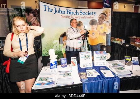 An exhibitor at AmericaFest 2025 in Phoenix, AZ. Dec. 19, 2025 Stock ...