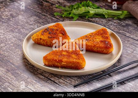 Fried golden fish cutlets triangles in the plate Stock Photo - Alamy