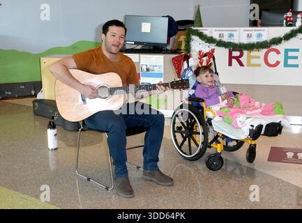 Country singer Daniel Harrison sings to the parents and patients at the ...