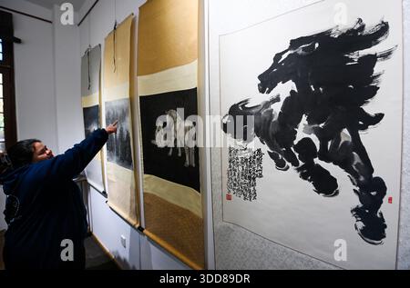 Visitors view the 'Year of the Horse' exhibition at Shanghai History ...