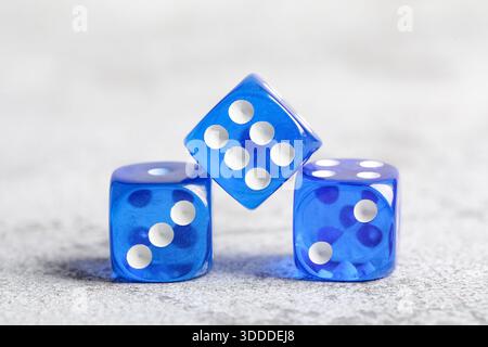 Blue dices on grey background Stock Photo - Alamy