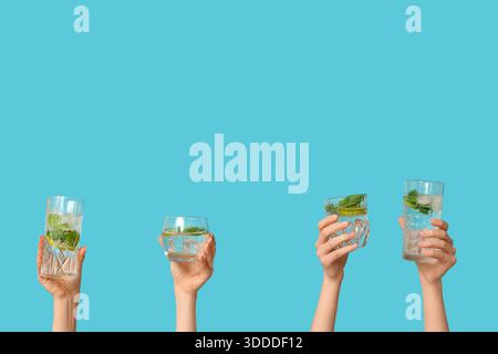 Female hands with different glasses of mojito on green background Stock ...