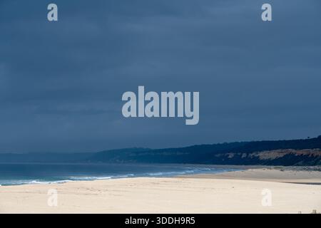 Sesimbra Portugal December 25 2025. A narrow paved road curves through ...
