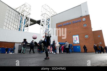 A young Blackburn Rovers fan playing football outside the ground before ...