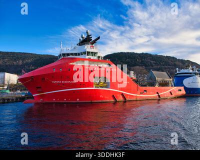 Industrial offshore anchor handling supply vessel sailing in open sea ...