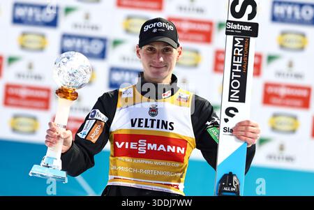 Domen Prevc, of Slovenia, celebrates on the podium after winning the ...