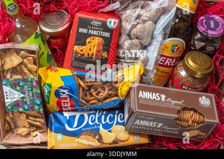 Christmas hamper full of European food and drink on white background ...