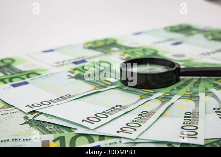 Euro Banknotes with Magnifying Glass Representing Financial Audit and ...