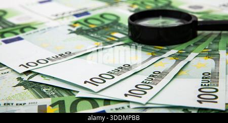 Euro Banknotes with Magnifying Glass Representing Financial Audit and ...