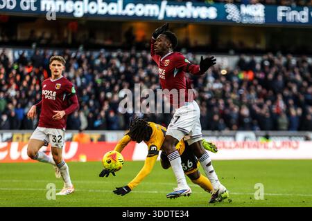 Mateus Mane of Wolverhampton Wanderers is fouled by Jake O'Brien of ...