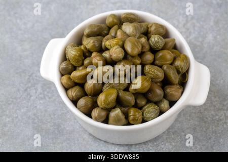 Marinated Capers in the bowl Stock Photo - Alamy
