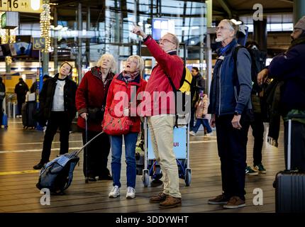SCHIPHOL - Travelers at Schiphol Airport. Hundreds of flights have been ...