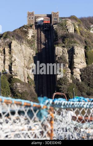 Close-up view of rugged coastal rocks with small tide pools, patches of ...