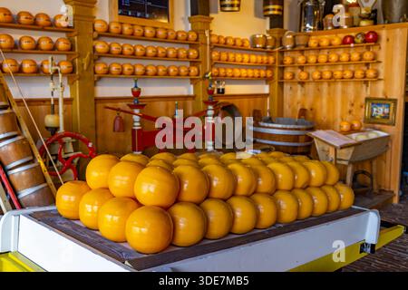 Traditional Dutch Cheese Shop with Stacked Cheese Wheels in three ...