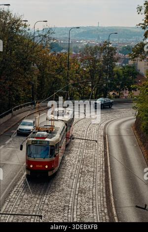 Vintage Tram Traveling Through Narrow Street with Colorful Buildings ...