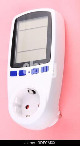 Digital Power Meter on pink background Stock Photo - Alamy
