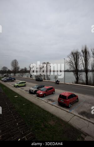 Mantova, Italy - 19TH FEBRUARY 2025 - Panoramic road with parked cars ...